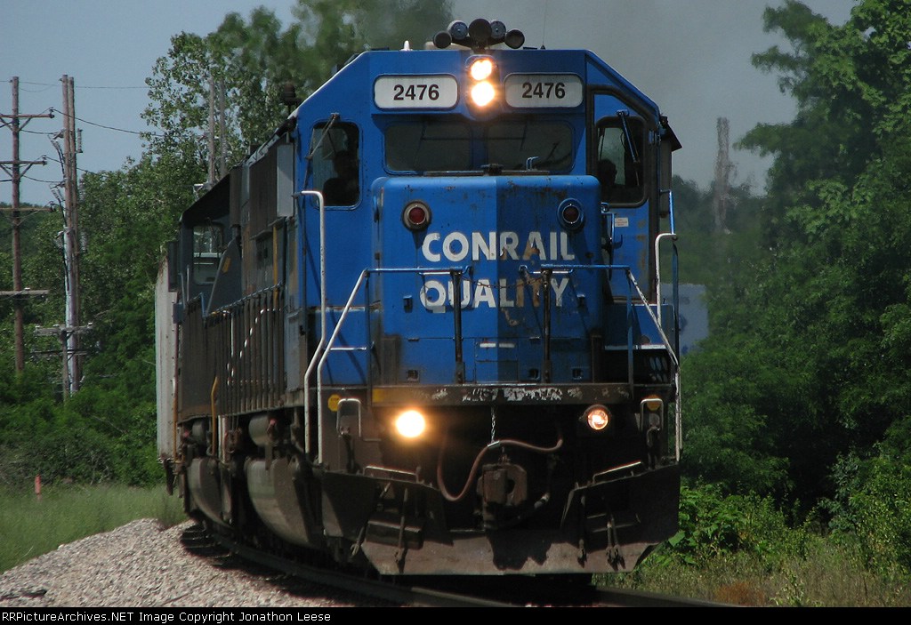 An empty ballast train heads east behind a pair of SD50-2's
